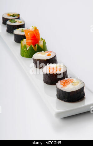 Close-up of sushi and rolls in the restaurant kitchen. Japanese ...