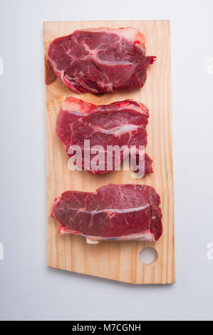 Vertical high angle shot of chopping boards with bread, cheese and ...