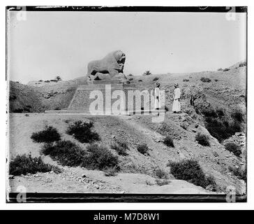 A basalt lion sculpture from ancient Babylon, featuring figures carved ...