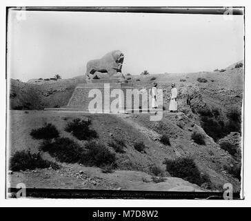 A basalt lion sculpture from ancient Babylon, featuring figures carved ...