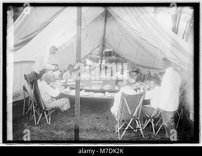 This photograph shows the mess hall set up for an evening meal at CCC ...