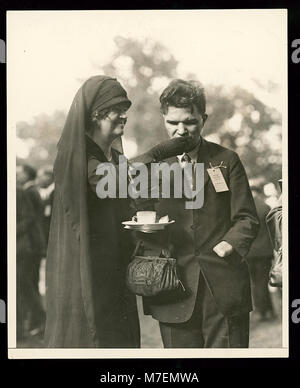 Mrs. Edith Nourse Rogers (R-Mass), left, studies uniforms worn by women ...