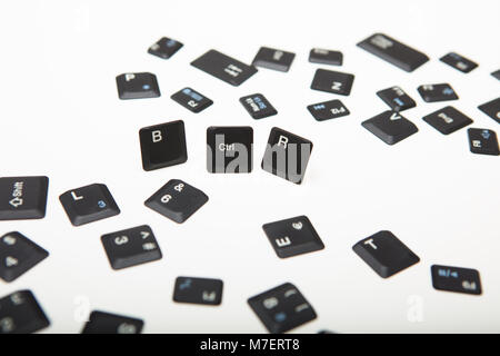 Computer keyboard composed of loose key covers from a computer with the ...