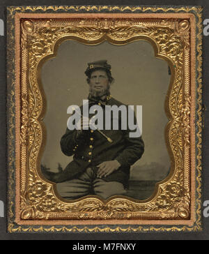An unidentified Union soldier stands in full uniform, wearing a plumed ...