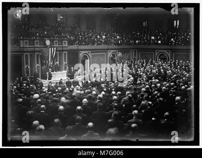 A photograph of President Woodrow Wilson addressing Congress during the ...