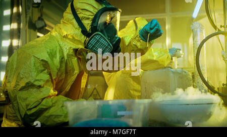 In the Underground Drug Laboratory Two Clandestine Chemists Wearing ...