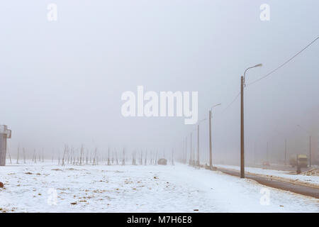 Thick fog early cloudy winter morning. Snowy landscape in the season of ...