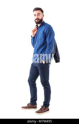 Over shoulder view bearded fashion designer fitting bespoke suit to ...