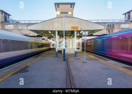 Woking station in Surrey with trains storming past the platforms on ...
