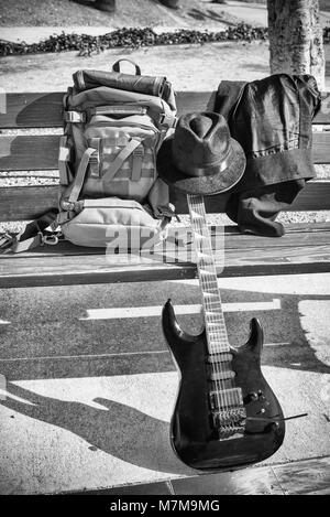 Free tramp lifestyle objects on a park bench Stock Photo - Alamy