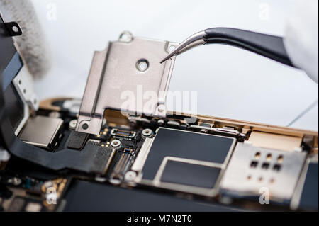 Close-up photos showing process of mobile phone repair Stock Photo - Alamy