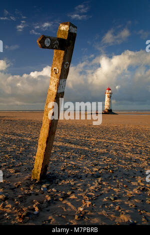 Derelict Point of Ayr lighthouse with decaying concrete path on Talacre ...