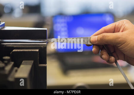 Inspection operator is check gap and dimension part in car factory ...