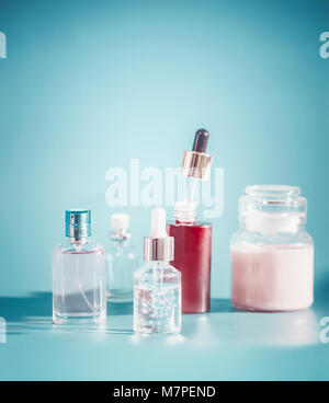 Blue skin care toner bottle on pink geometrical background Stock Photo ...