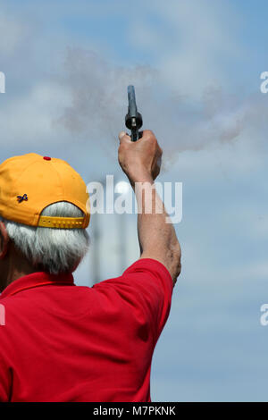 Man firing the starting gun for a race Stock Photo - Alamy