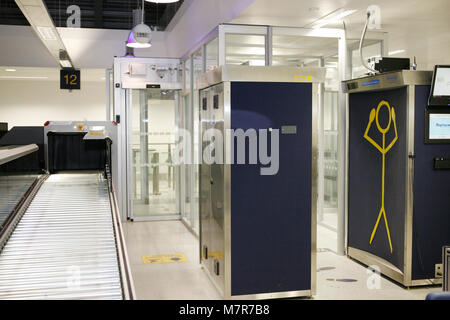 The 'Rapiscan' body scanner at the departures security. HM UK Border ...