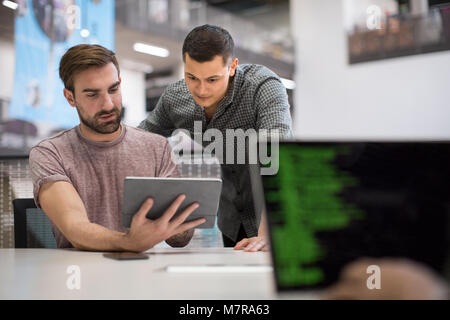 Coders working in an office Stock Photo - Alamy