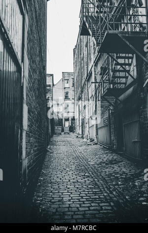 Cobbled back alleyway in the centre of Lancaster, northern Britain ...