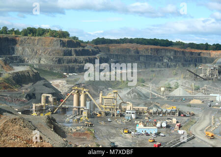 A Rock Quarry with equipment and trucks Stock Photo - Alamy