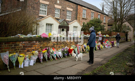 Floral tributes grow outside the home of Liverpool comedian Sir Ken ...
