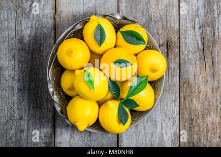 Fresh lemons on market table, top view Stock Photo - Alamy