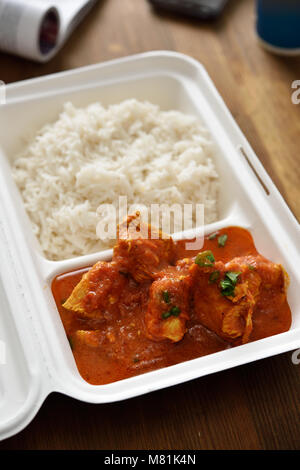 Chicken curry with rice in a disposable container Stock Photo - Alamy