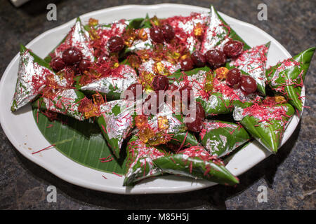Traditional indian dessert Paan made with Betel leaf and other ...