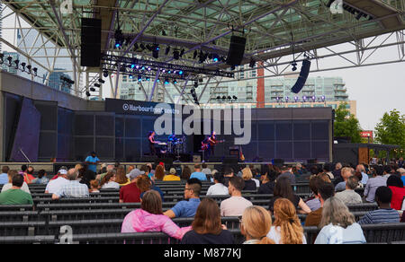 Audience listening to live music at the Harbourfront Centre, Toronto ...