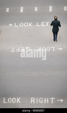 Iconic 'look right' painted road marking for pedestrians in London ...