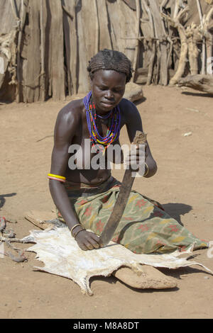 Africa Ethiopia Omo Valley Curing leather Daasanach tribe Stock Photo ...