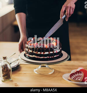 cutting a cake sweets, cake and cookies Stock Photo - Alamy