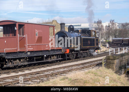 A small tank engine pulls into the railway station at Halesworth ...