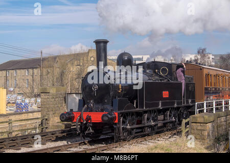 A small tank engine pulls into the railway station at Halesworth ...