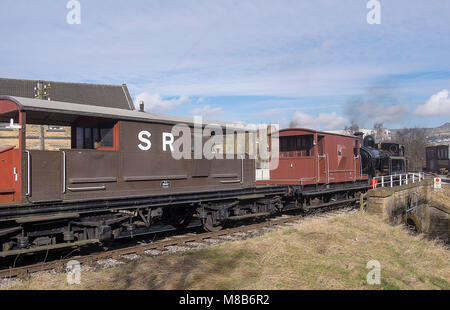 A small tank engine pulls into the railway station at Halesworth ...