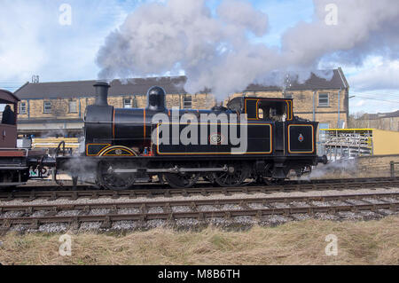 A small tank engine pulls into the railway station at Halesworth ...