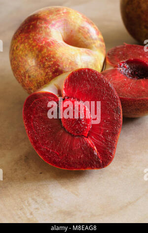 Watermelon plums an unusual variety with red flesh and green skin ...