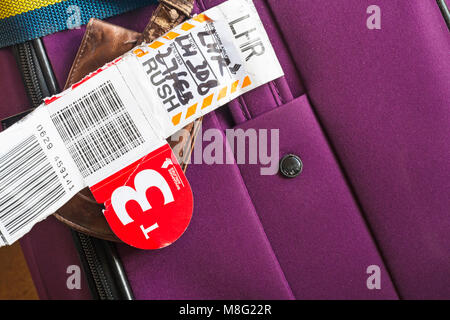 A suitcase with a airline barcode baggage tag from London Heathrow (LHR ...