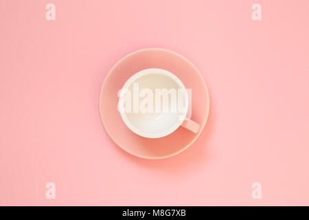Small white coffee cup and pink sunglasses on texture background of ...