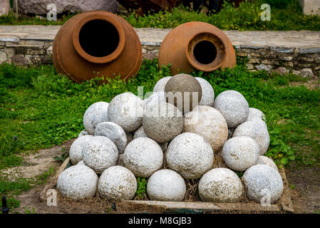 old stone cannon balls, ancient weapon Stock Photo - Alamy