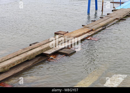 Floating Plank Boards Bridge Over Water Floods Stock Photo - Alamy