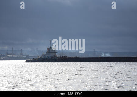 Large cargo barges transporting iron ore mined in hinterland to the ...