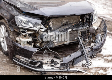 Road accident. Car with the front bumper ripped off following a ...
