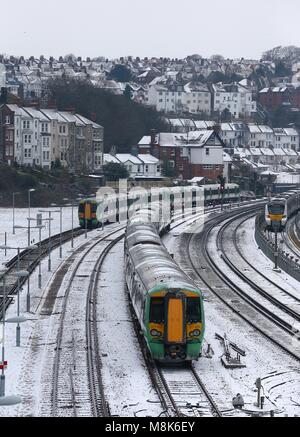 Trains pull out of Brighton station in the snow.18 Mar 2018. Picture ...