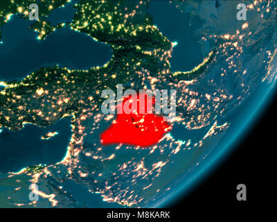 Night view of Iraq highlighted in red on planet Earth with atmosphere ...