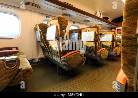Interior of Shinkansen, Bullet train, carriage with three seats on one side, and two on the ...