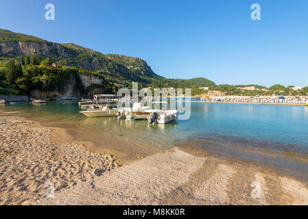 Alipa beach in Paleokastritsa bay with sand and crystal sea water ...