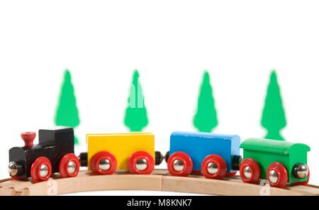 Wooden toy trains. Isolated on white background Stock Photo - Alamy