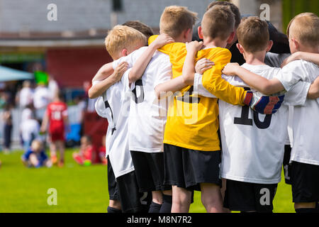 Coaching Kids Soccer. Football Team with Coach at the Stadium. Boys ...