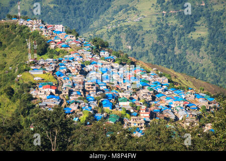 A small rural houses with trees and mountain in the background Stock ...
