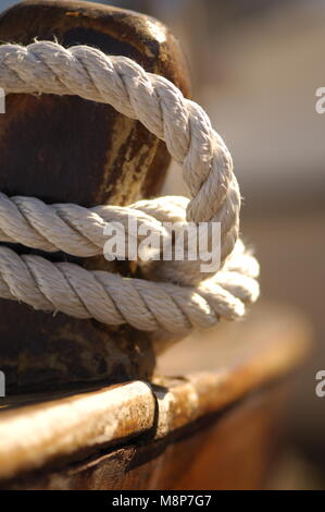 old wooden fishing boat cleats with rope wrapped around. Close-up Stock ...